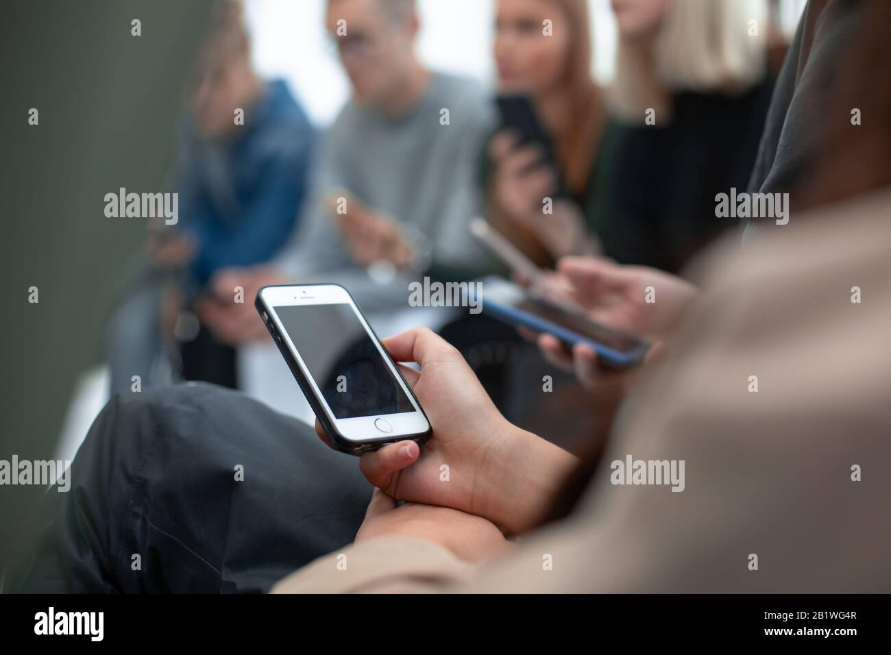 image of a smartphone in the hands of a young man Stock Photo - Alamy