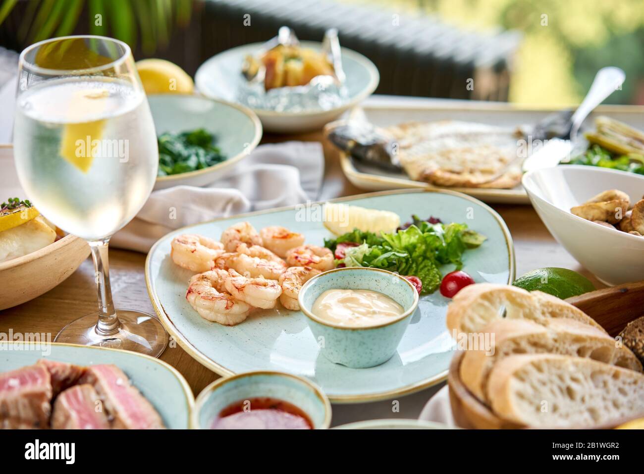 Many different delicious dishes dishes on the table. Various snacks and ...