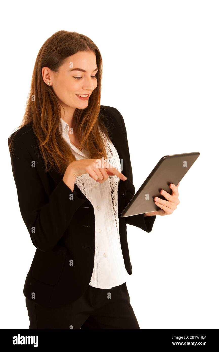 attractive young business woman checking data on a tablet computer ...