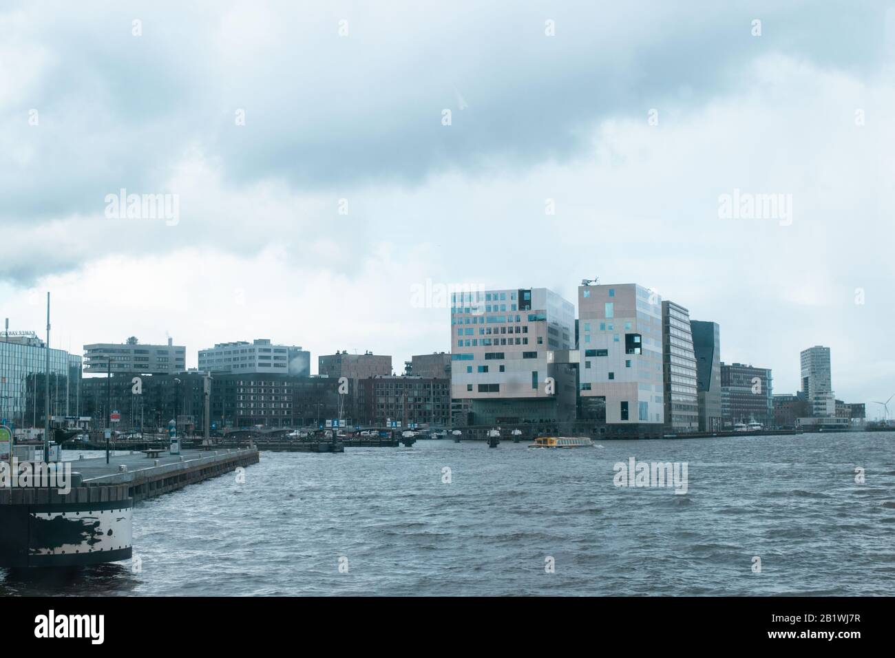 The River the IJ in front of the Dutch cit of Amsterdam, The ...