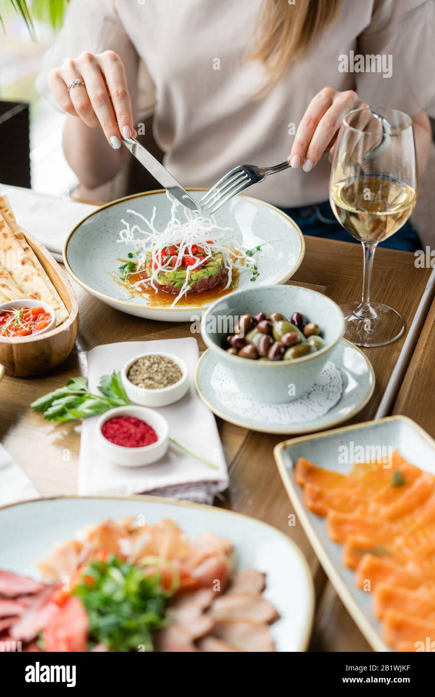 Beautiful young elegant woman in the restaurant with a wine glass ...