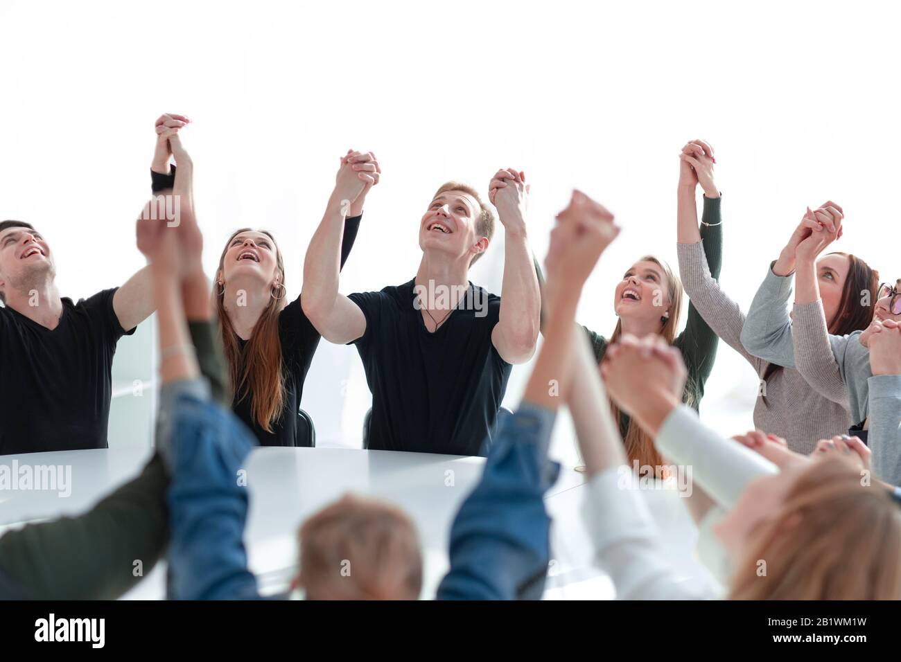 close up. a team of young people showing their unity Stock Photo - Alamy