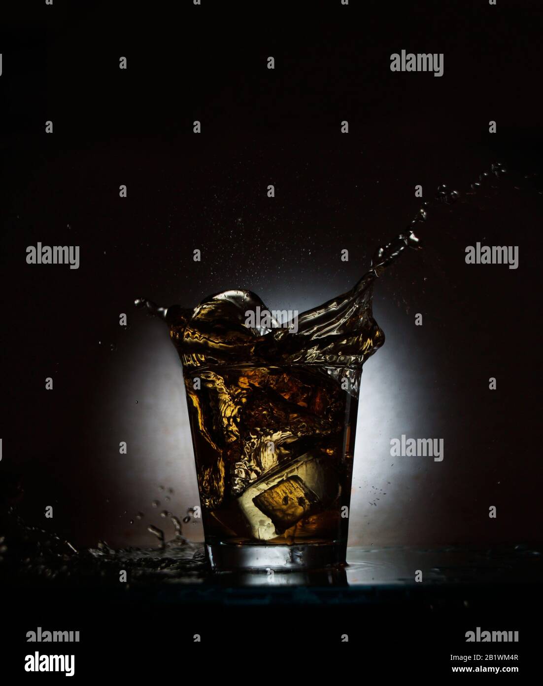 Splashing rocks glass hi-res stock photography and images - Alamy