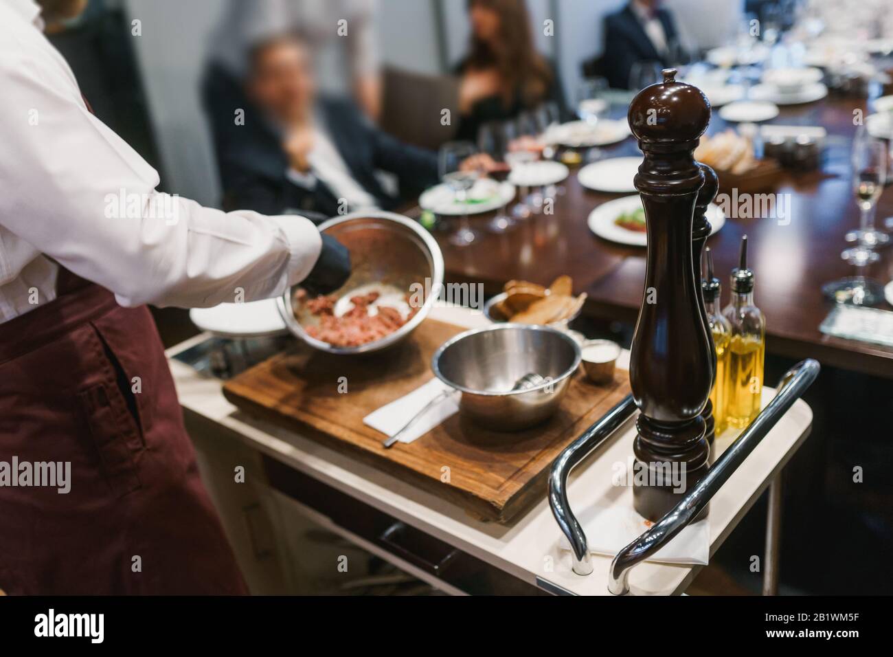 Chef cooking in front of visitors of an expensive restaurant Stock ...