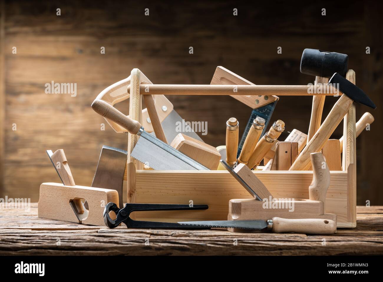 Toolbox With Carpenter Worktools Against Wooden Background Stock Photo ...