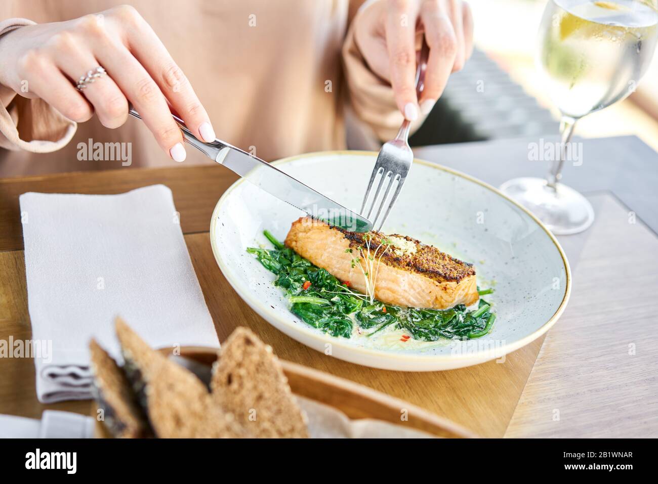 Salmon steak fillet with grainy mustard and spinach. Lunch in a ...