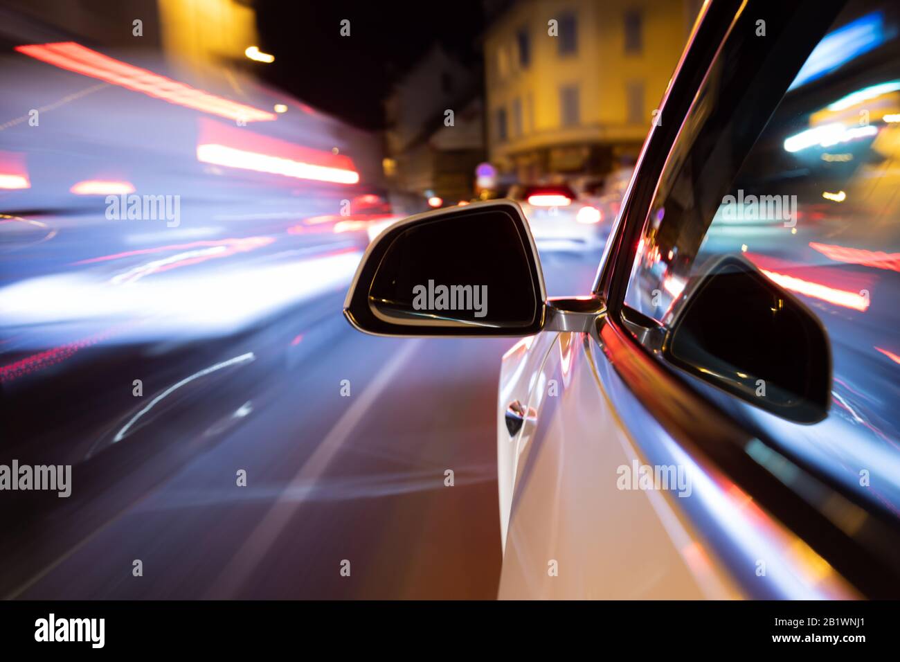 Car light trail while driving in the coty by night Stock Photo - Alamy
