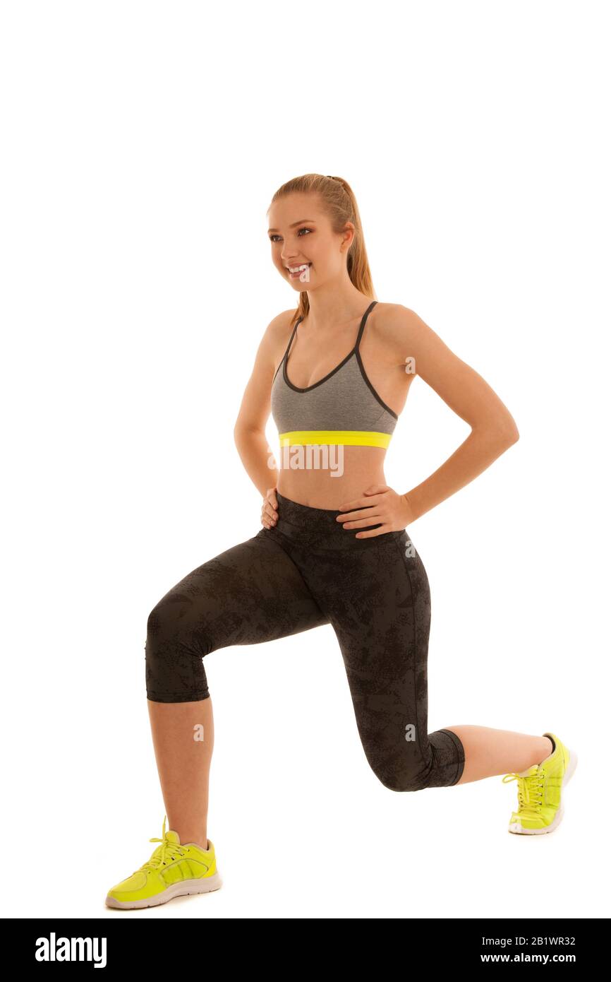 beautiful young fit woman makes lunge step isolated over white ...