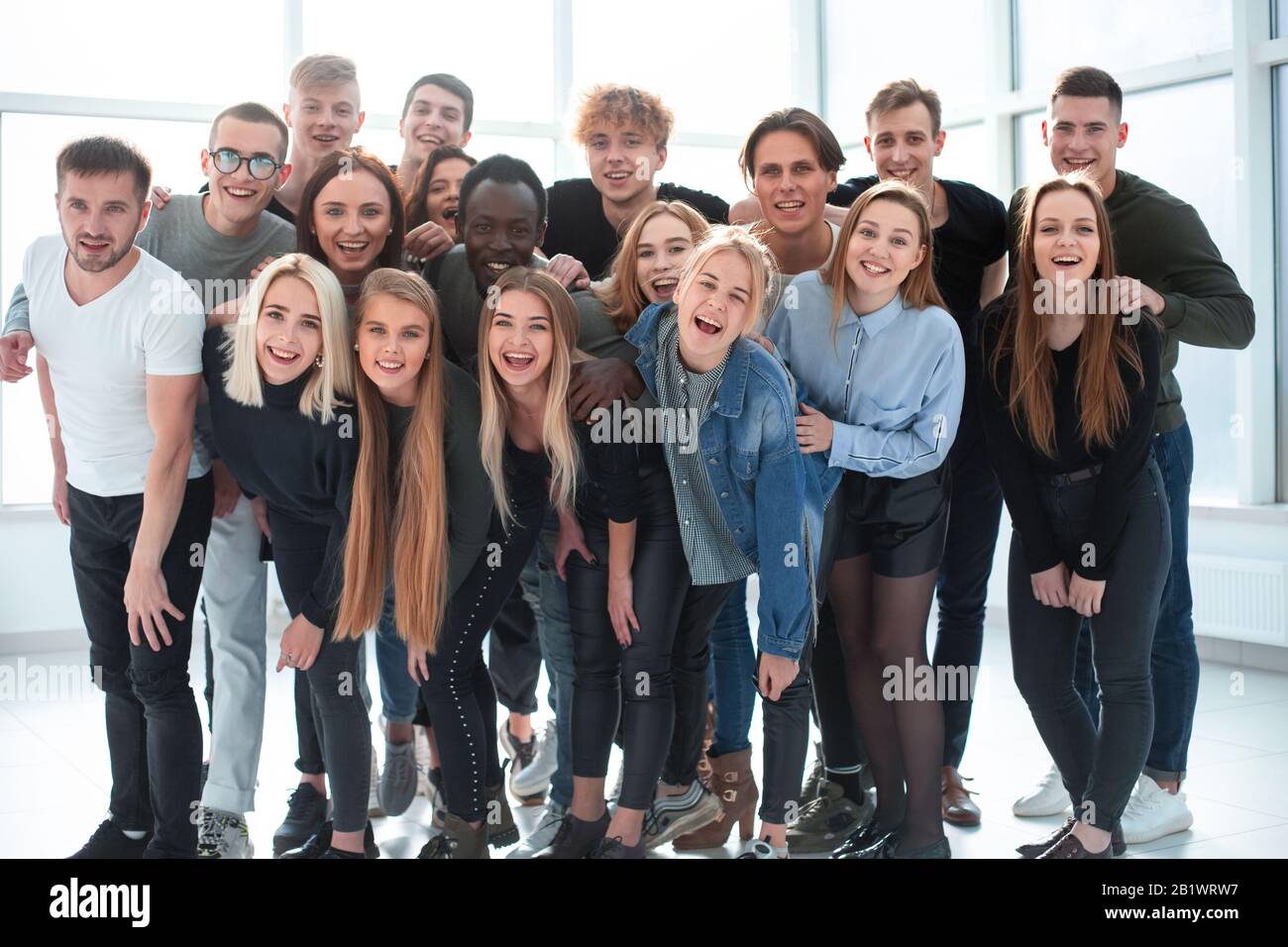 group of happy friends standing together . close up Stock Photo - Alamy