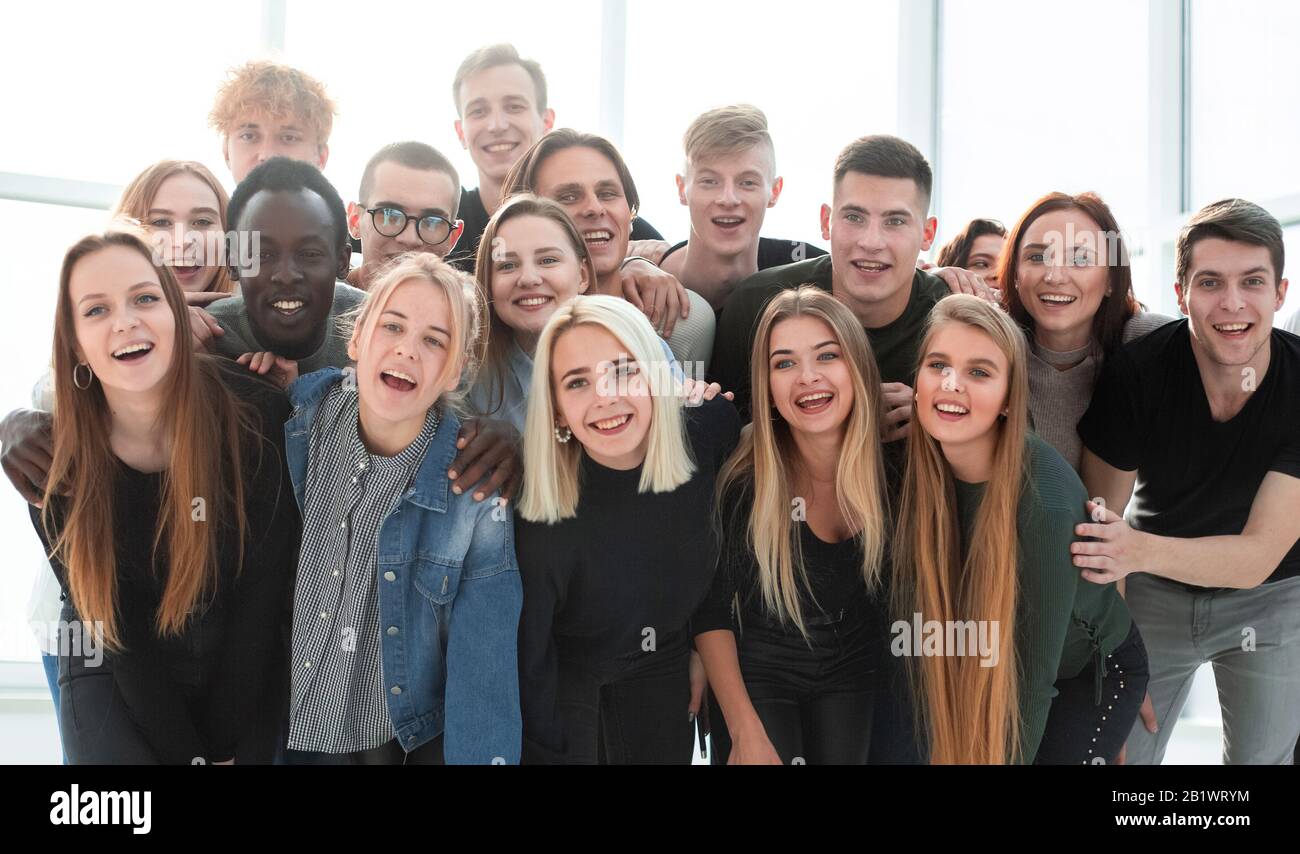 group of happy friends standing together . close up Stock Photo - Alamy