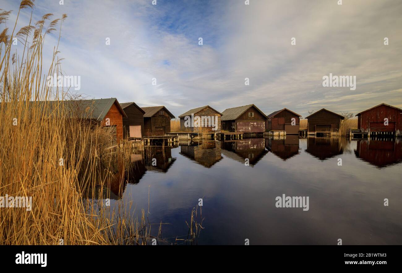 Neusiedler See, Lake Neusiedl. Bay with wooden pier and wooden cottage ...