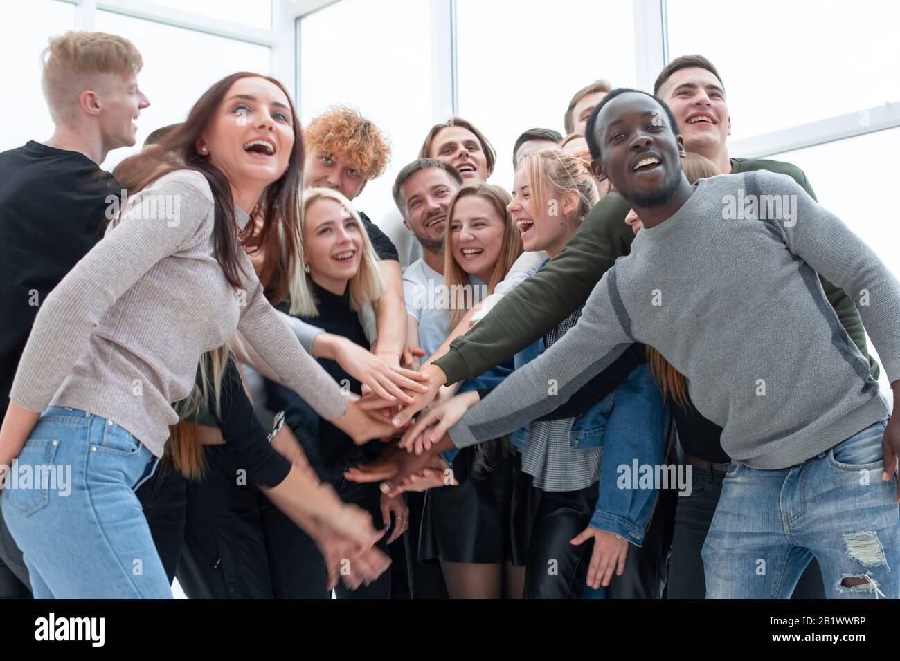group of happy young people showing their unity Stock Photo - Alamy