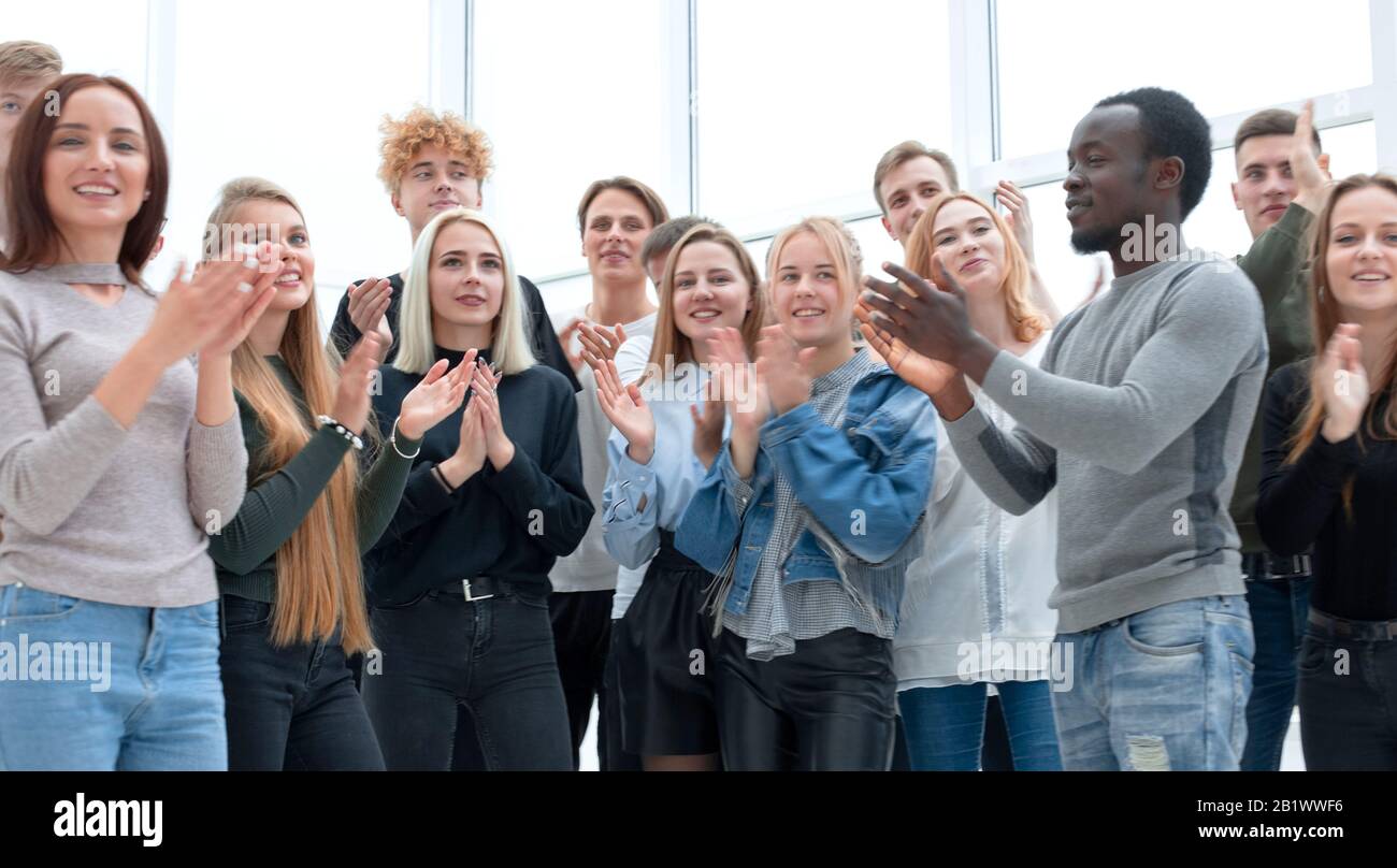 group of young people applauding . photo with copy space Stock Photo ...