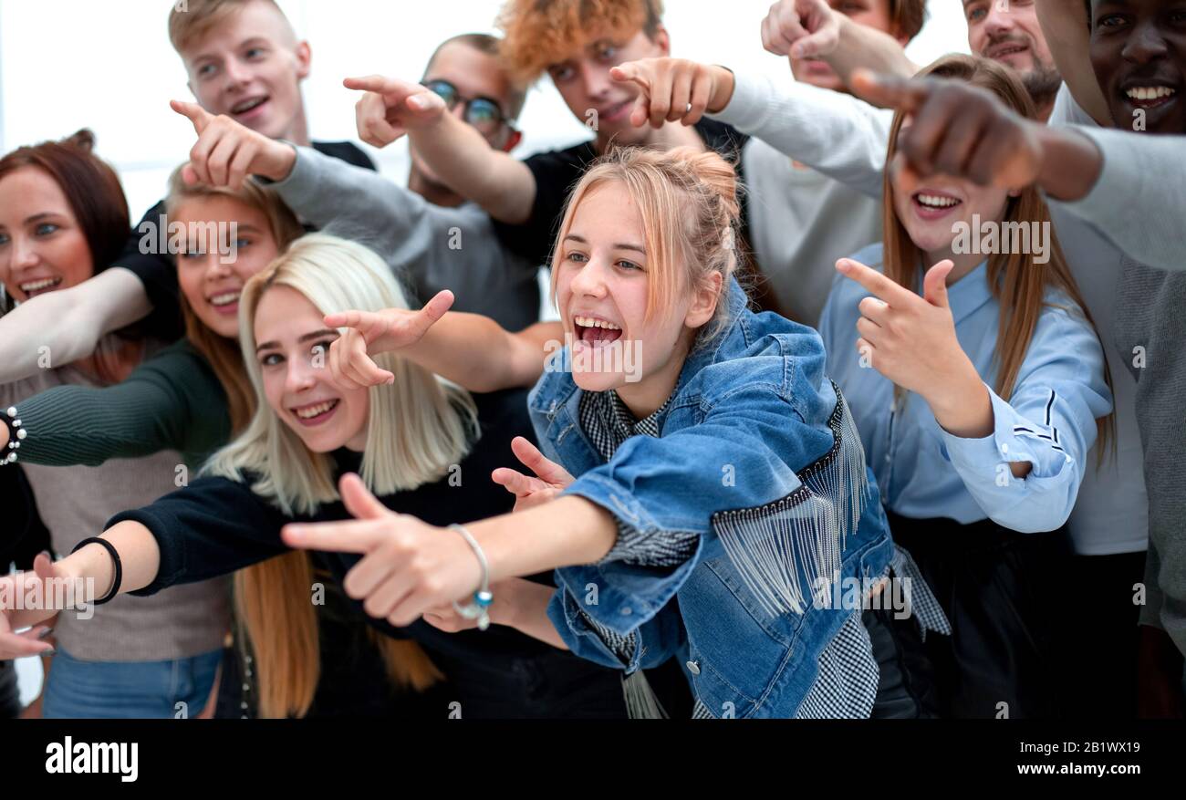 close up. a group of young people pointing at one point Stock Photo - Alamy