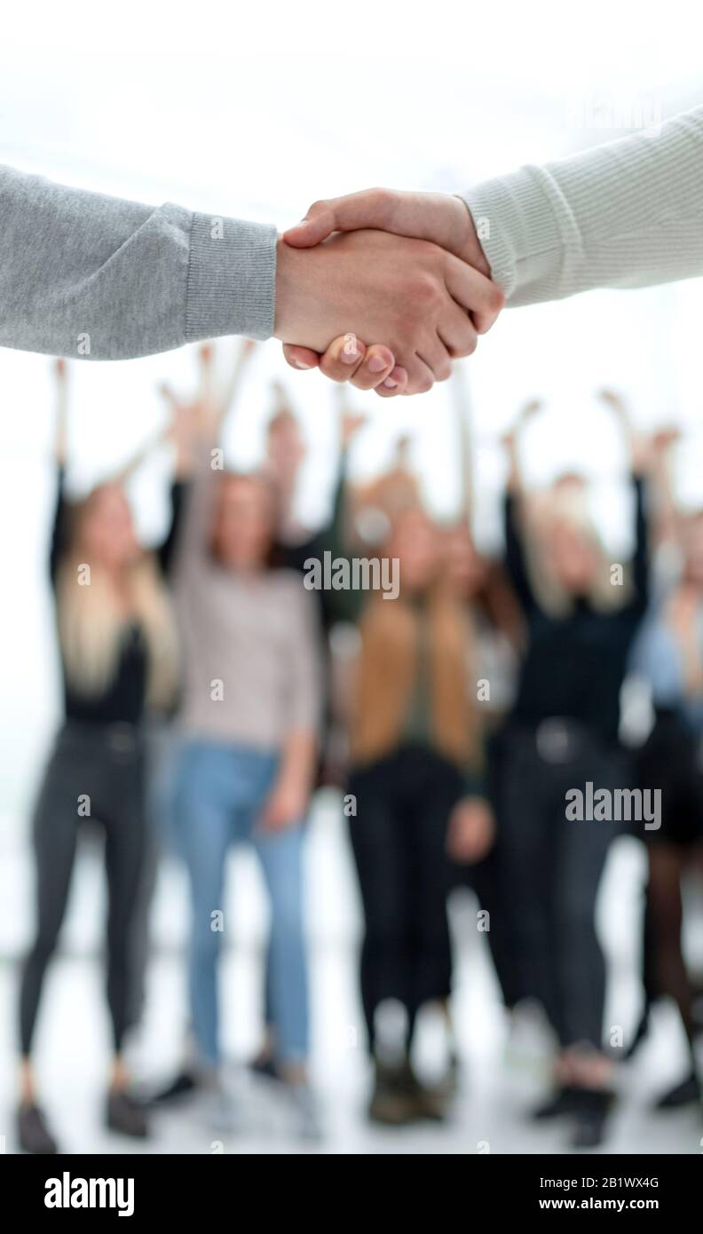 close up. a firm handshake on a blurred business background Stock Photo ...