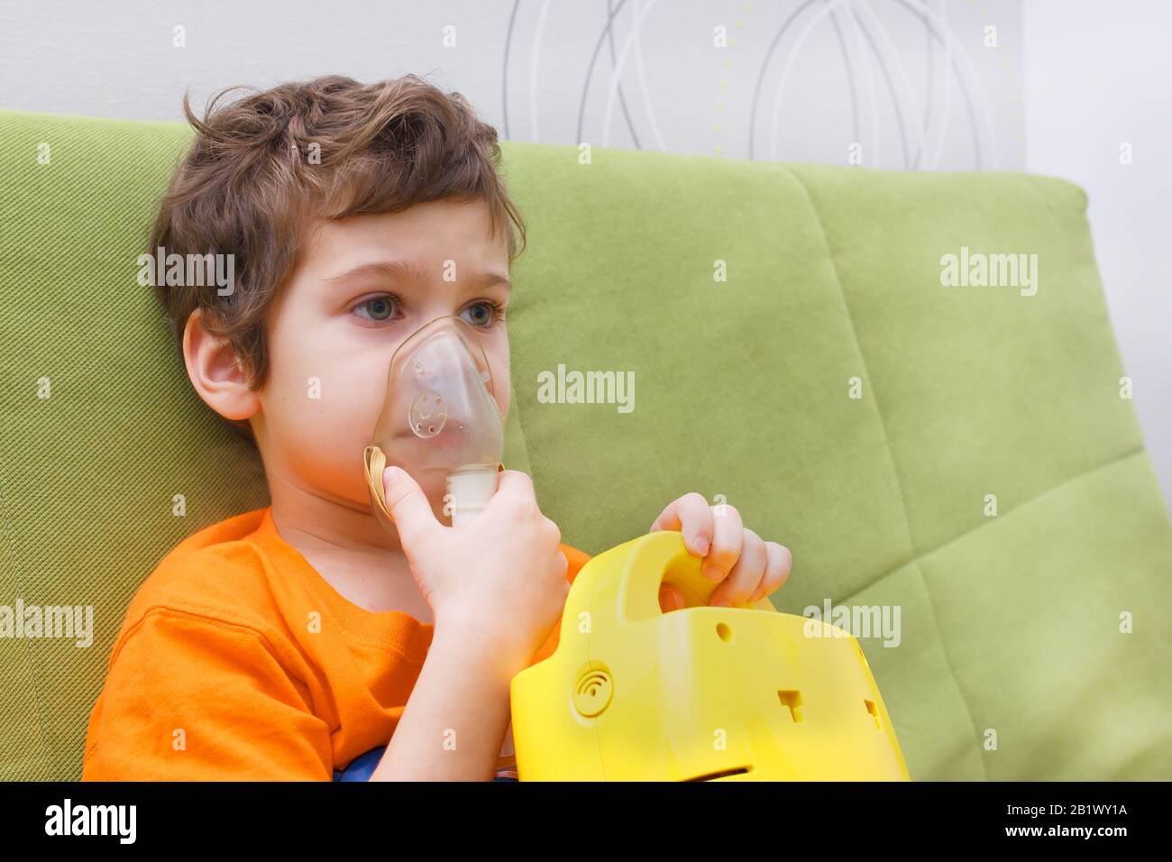 boy makes inhalation through a nebulizer Stock Photo - Alamy