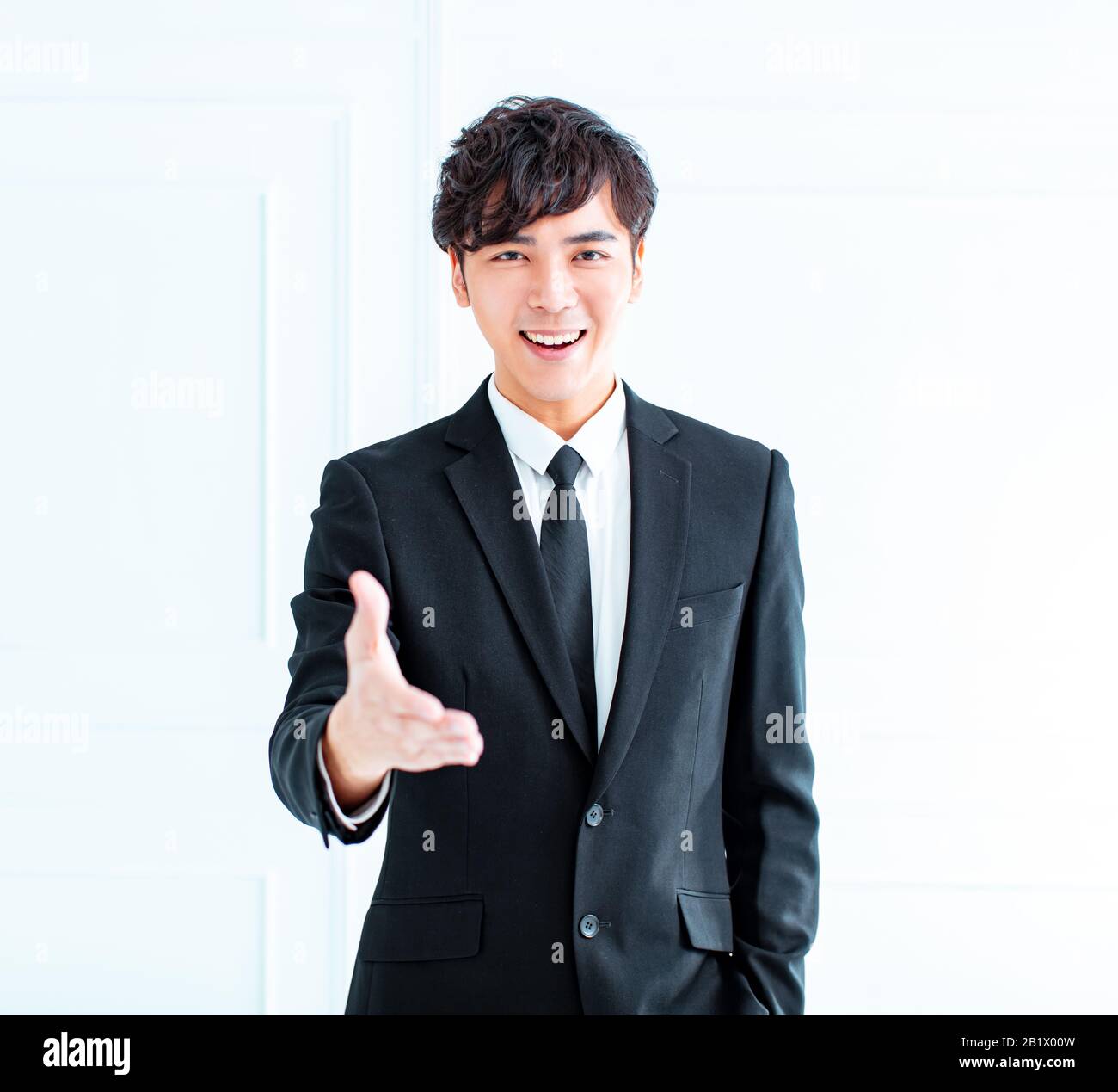 Businessman reaching out hand handshake hi-res stock photography and ...