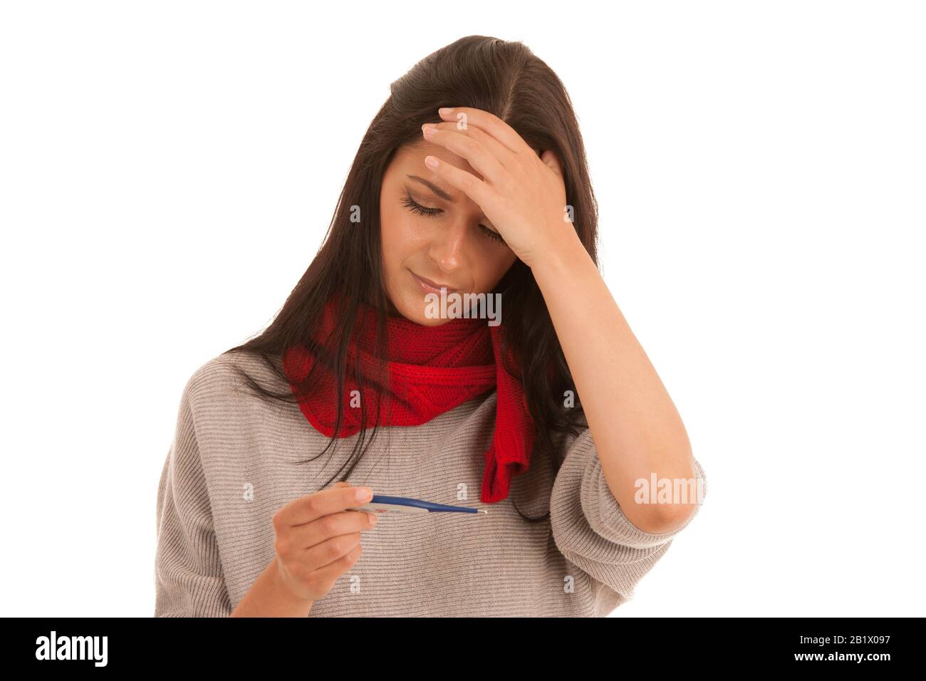 Ill woman has fever checking body temperature with thermometer isolated ...