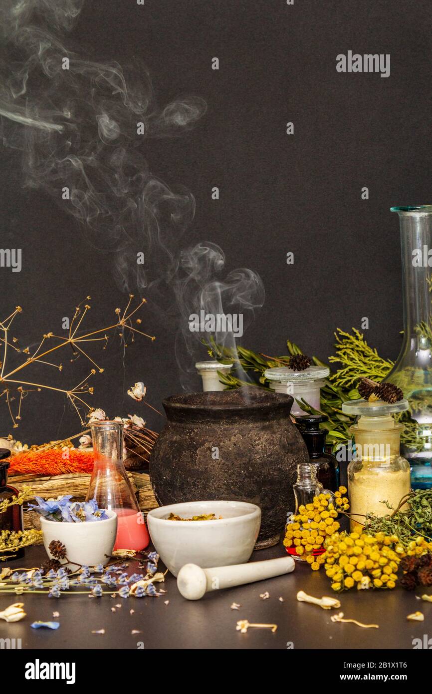 Halloween concept. Alchemy laboratory of the witch. Flasks, retorts ...