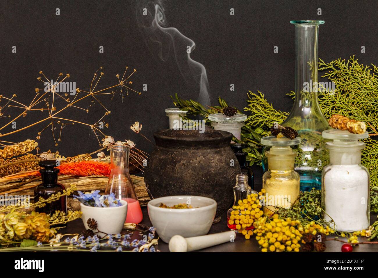 Halloween concept. Alchemy laboratory of the witch. Flasks, retorts ...