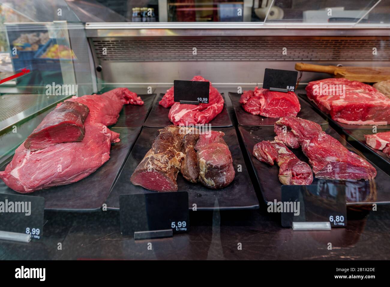 Front view at display counter of butcher shop with various type of ...