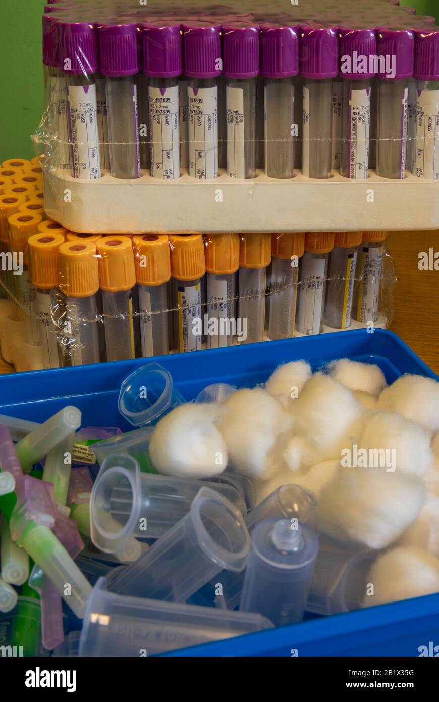 A collection of blood testing equipment including vials, needles and ...