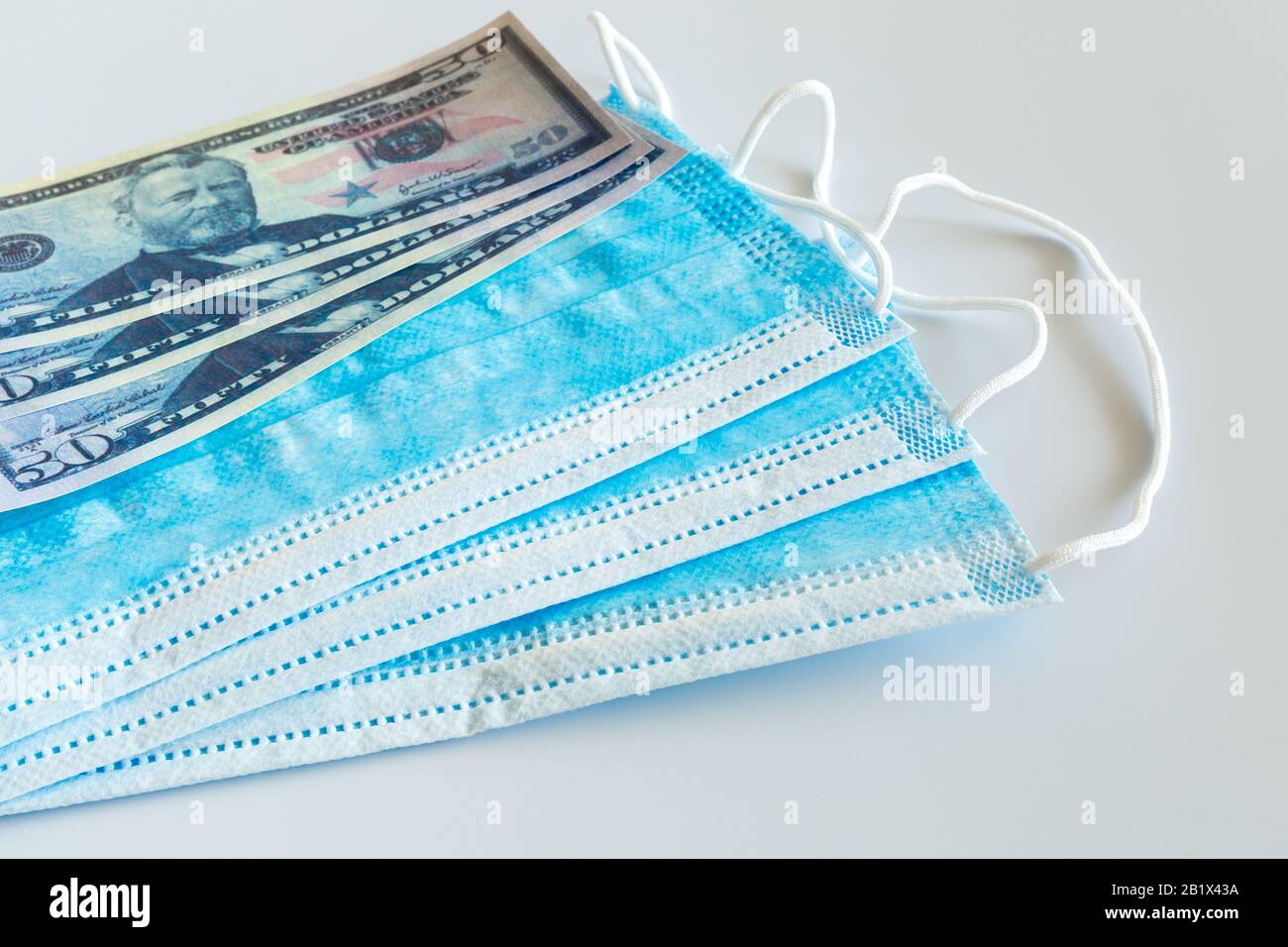 Medical masks and 50 dollars bills as a symbol of higher prices for ...