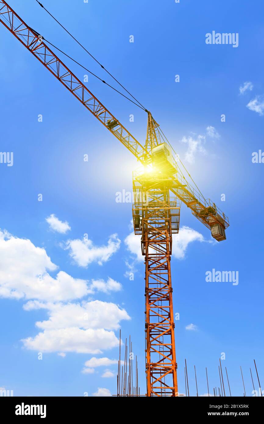 Crane in work at the construction site Stock Photo - Alamy