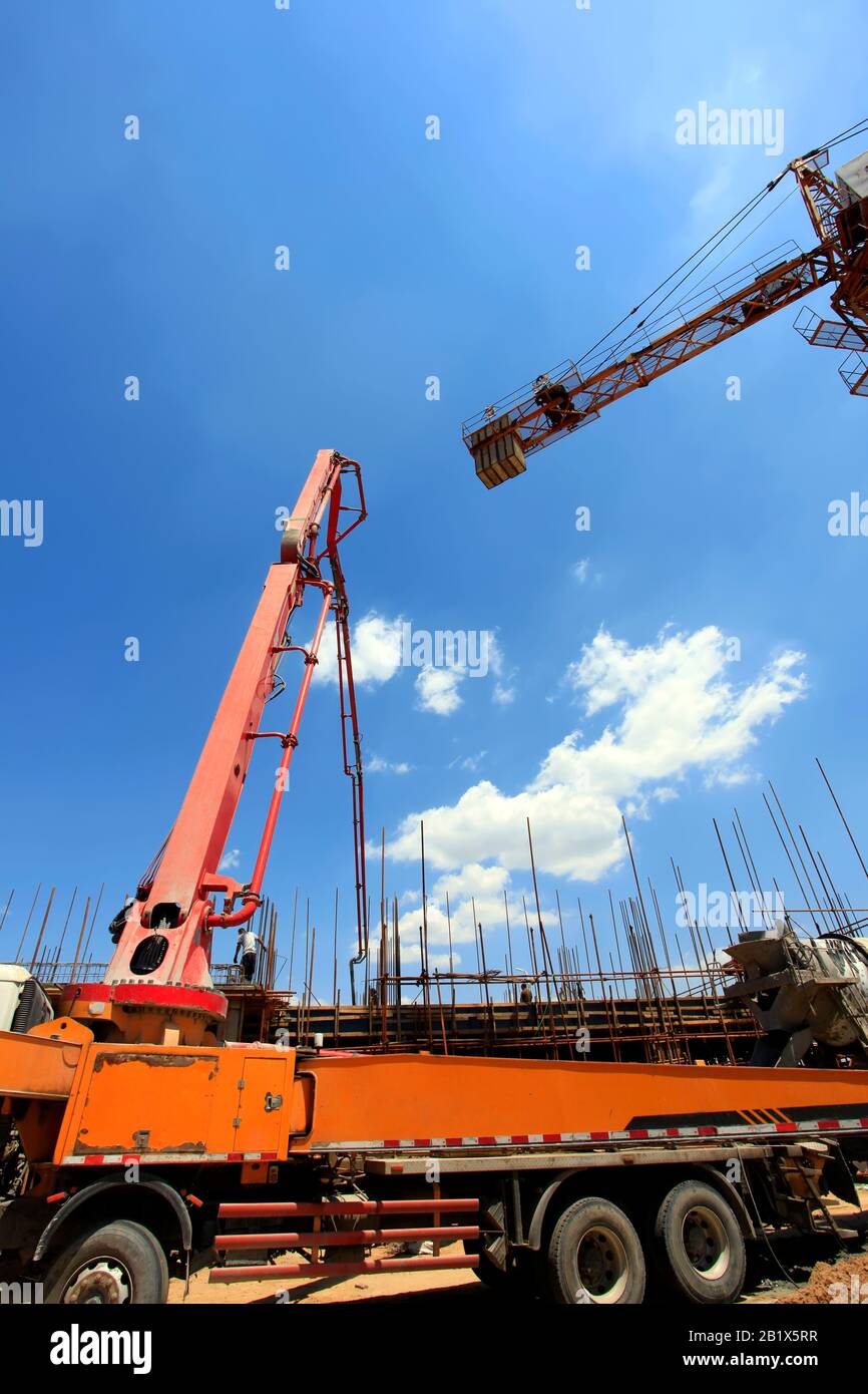 Crane in work at the construction site Stock Photo - Alamy