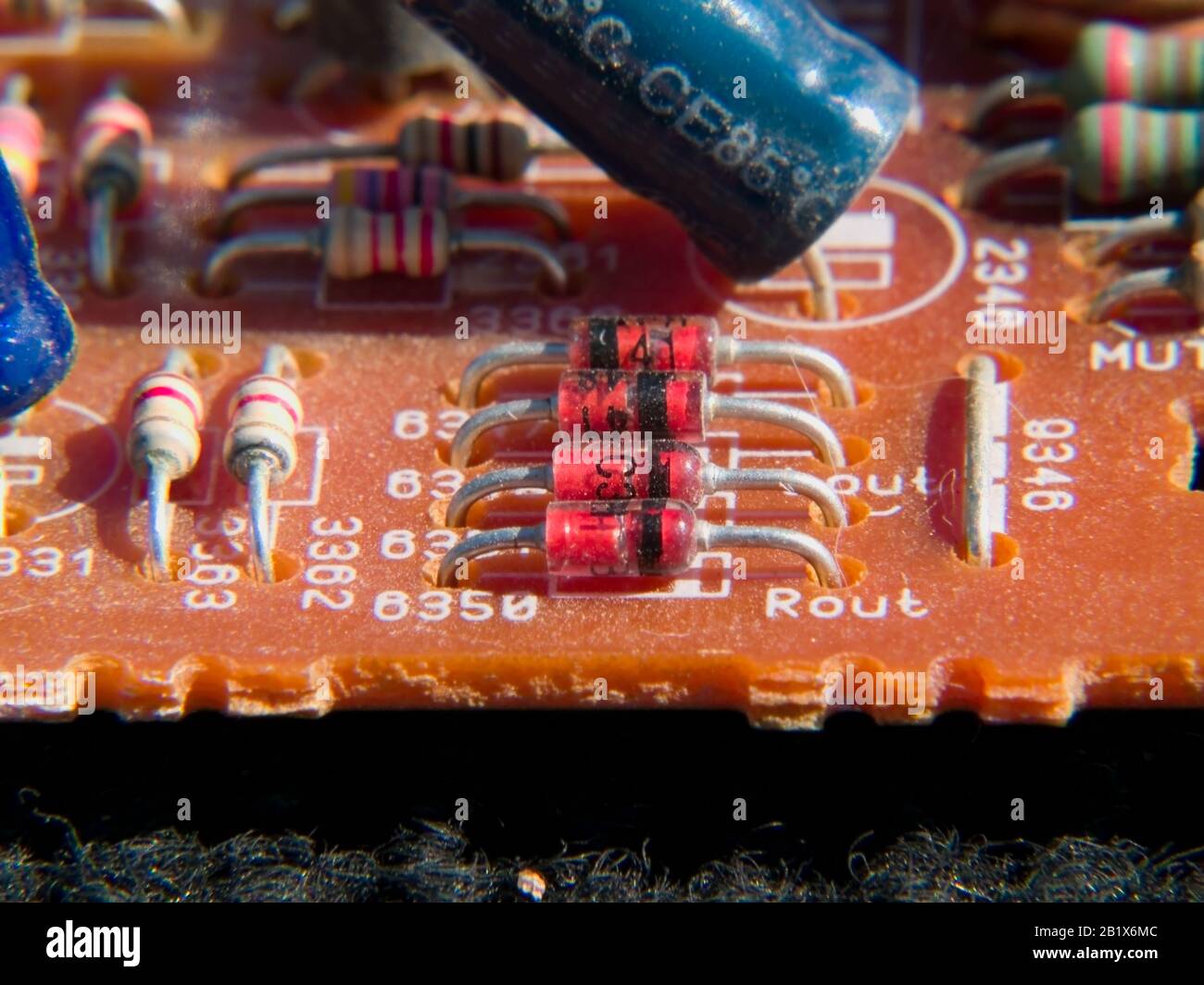 A macro photo of a typical electronic circuit board showing diodes ...