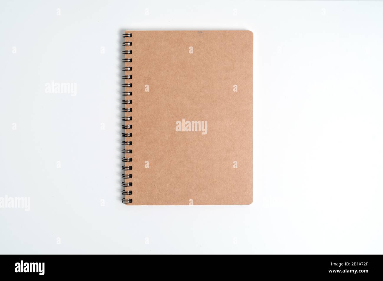Brown spiral notebook isolated on white background.top view Stock Photo ...