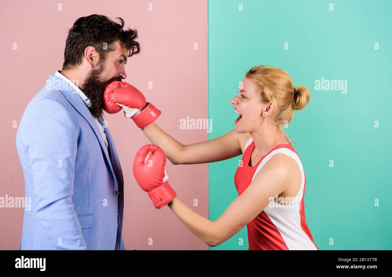 Strong punch. Boxers fighting in gloves. Gender equality. Man and woman ...