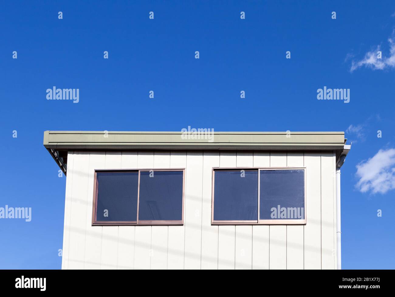 Wall of building with windows Stock Photo - Alamy