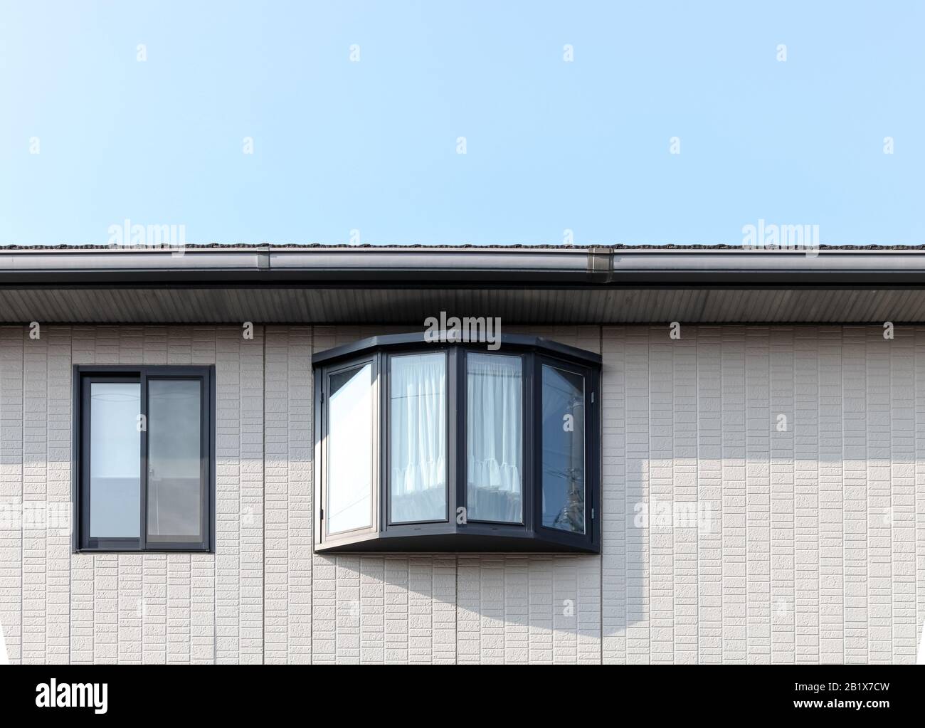 Wall of building with windows Stock Photo - Alamy