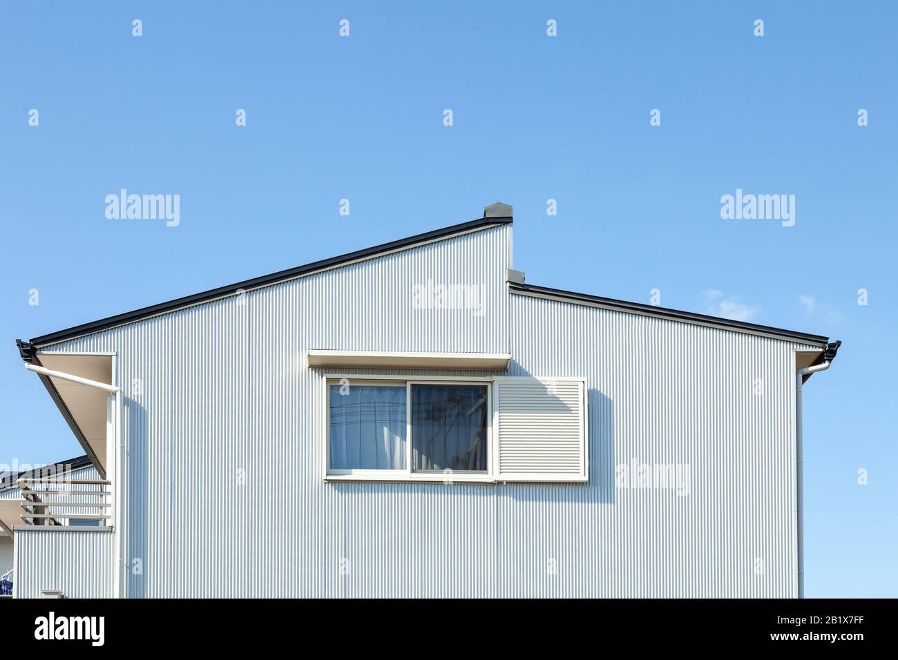 Wall of building with windows Stock Photo - Alamy
