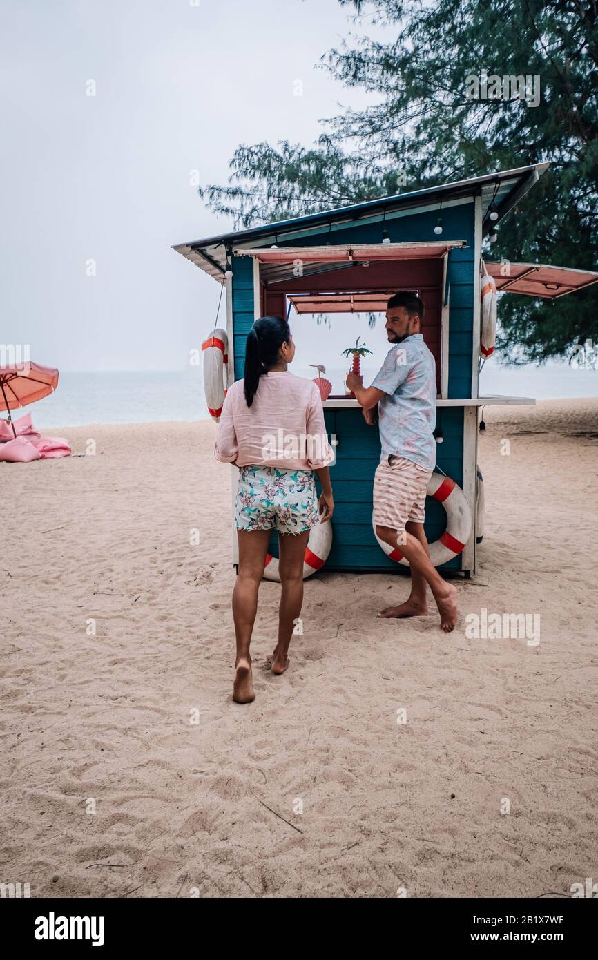 Tutu beach Pattaya Thailand, couple relax on the beach, men and woman ...
