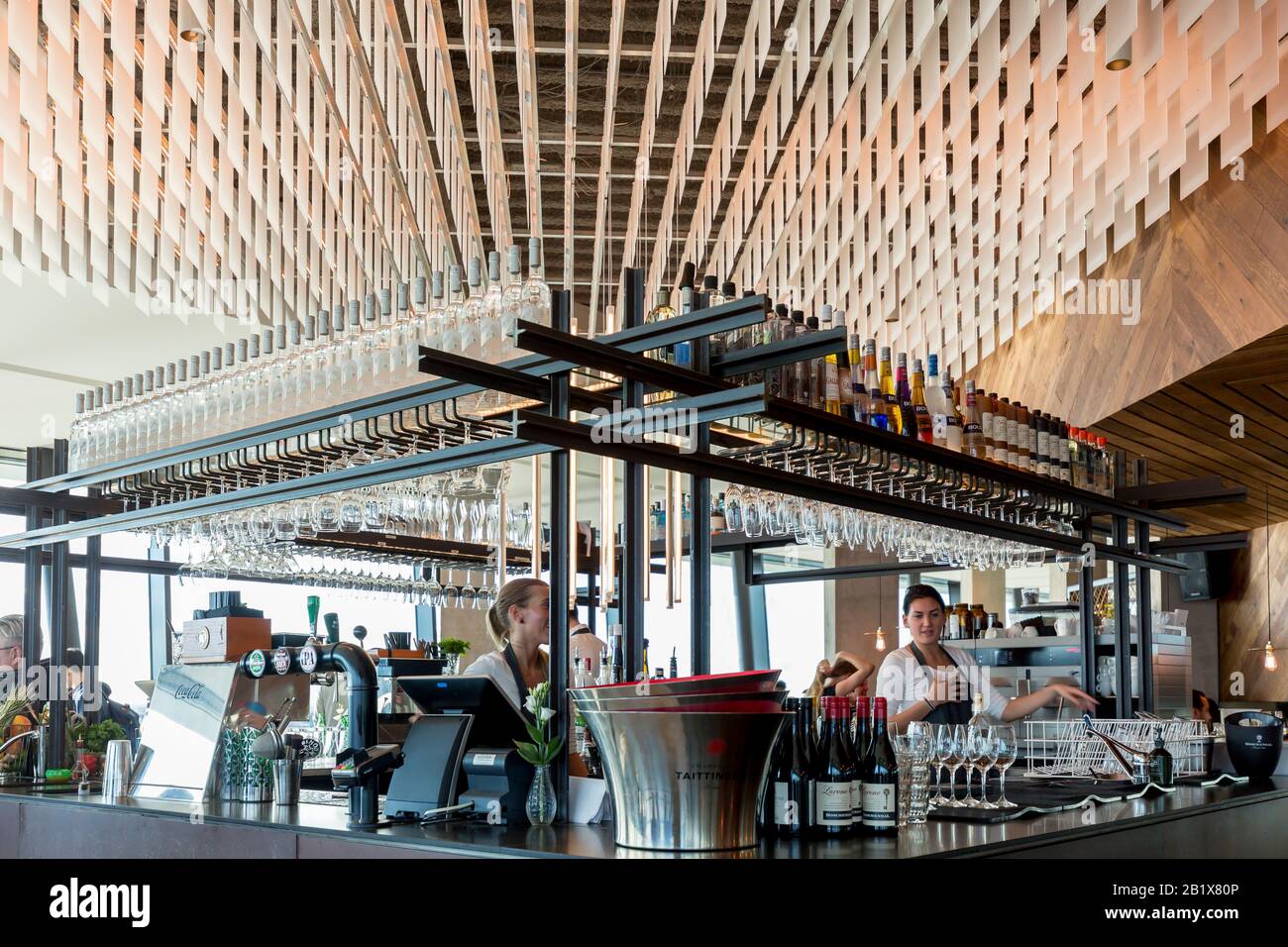 Modern design bar with two female bartenders Stock Photo - Alamy
