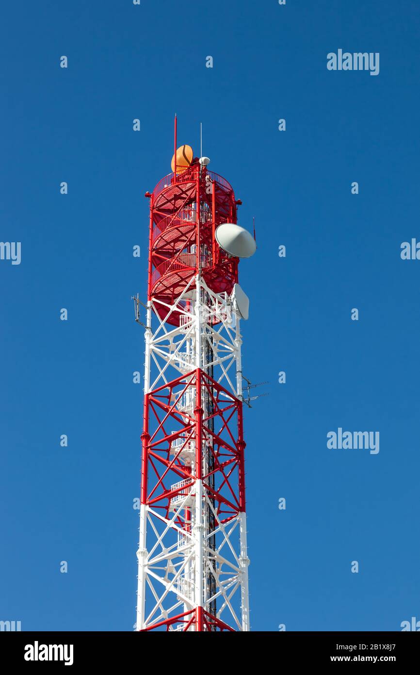 Antenna transmission tower., painted white and red in a day of clear ...