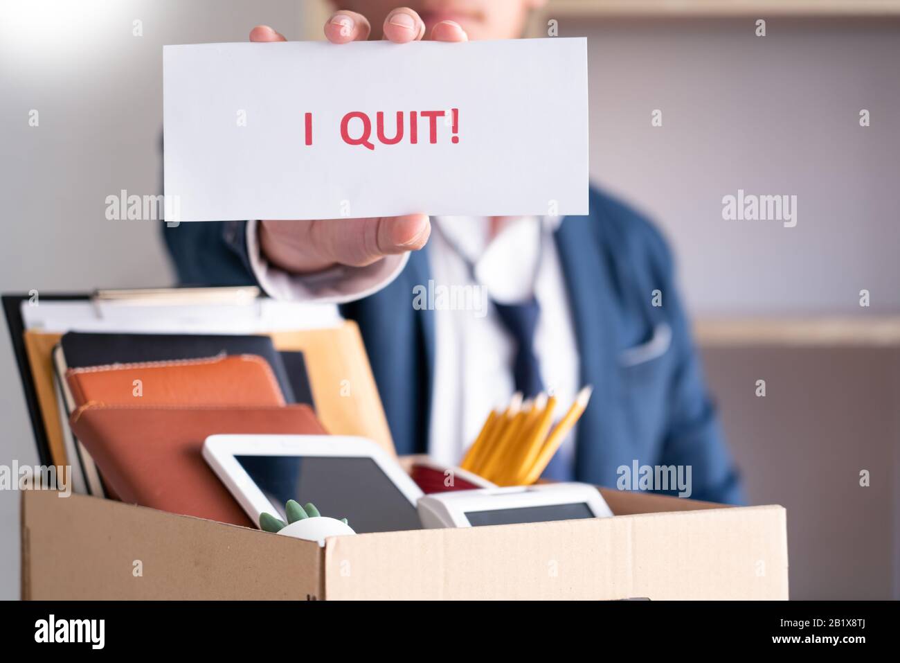 Businessman holding with I quit words card letter, resign employee ...