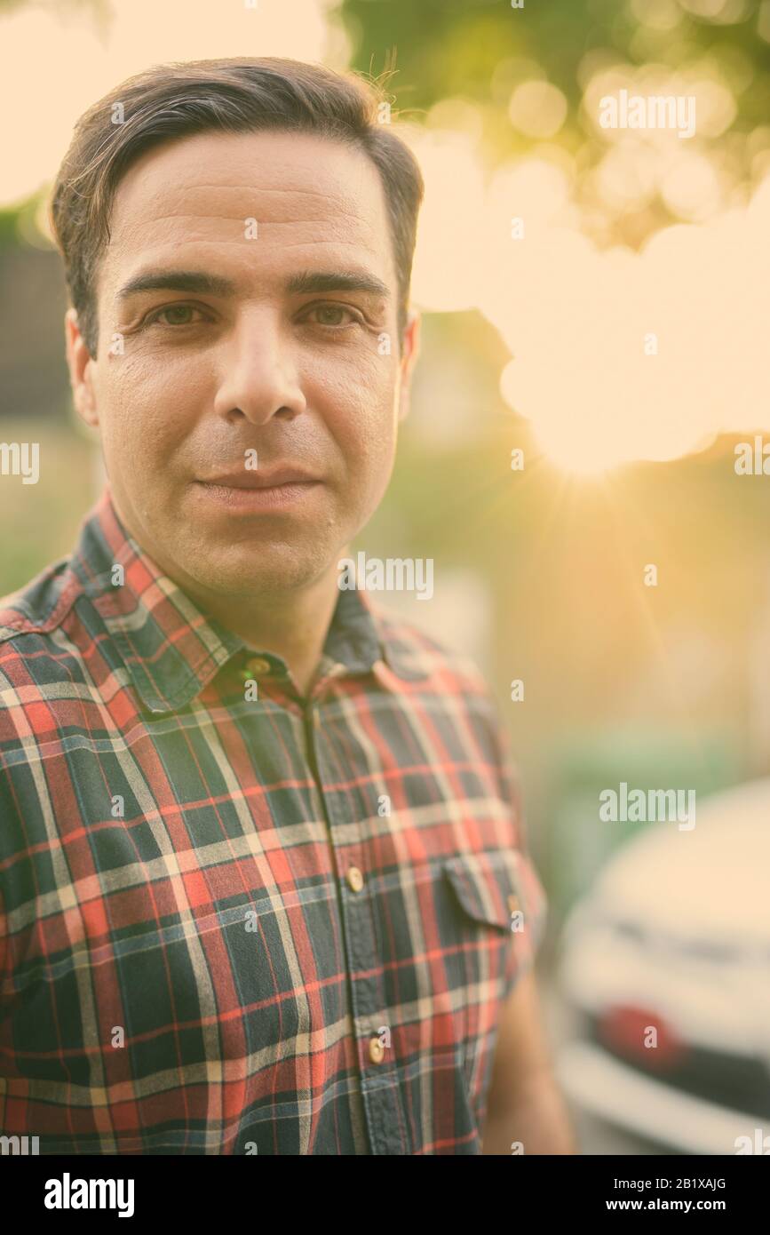 Portrait of handsome Persian man in the streets outdoors Stock Photo ...