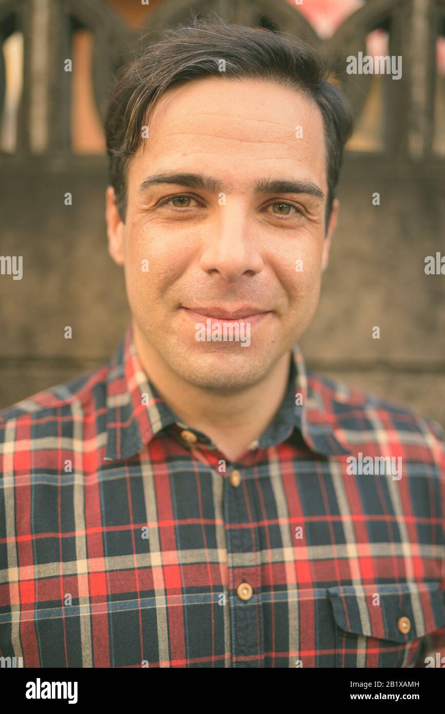 Portrait of handsome Persian man in the streets outdoors Stock Photo ...