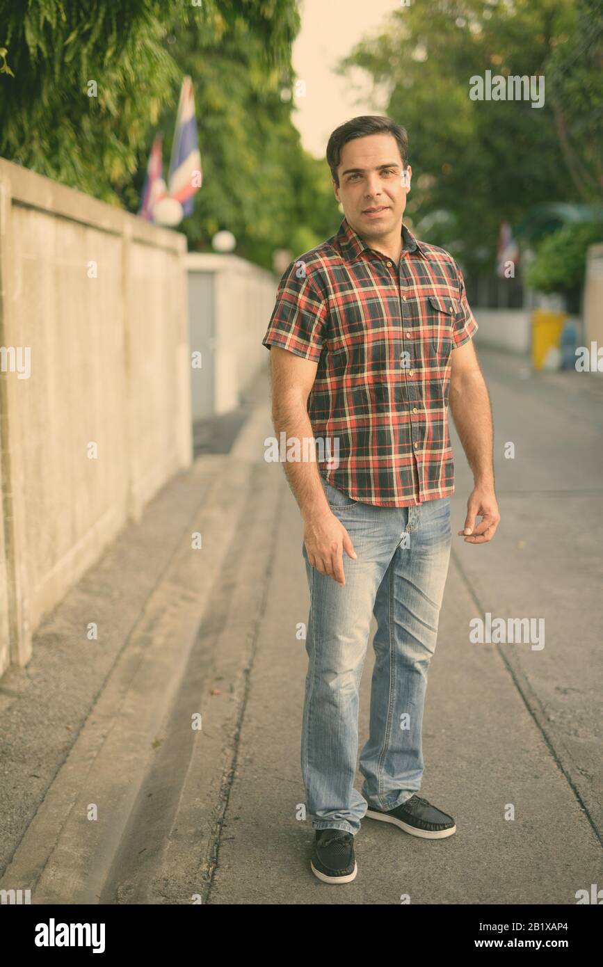 Portrait of handsome Persian man in the streets outdoors Stock Photo ...