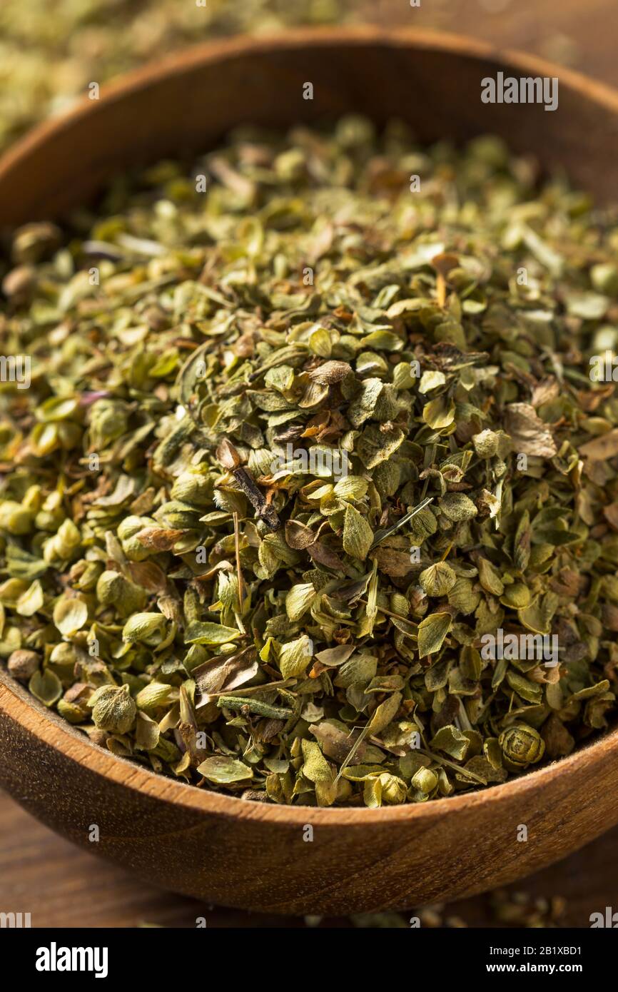 Raw Dried Green Greek Oregano Spice in a Bowl Stock Photo - Alamy
