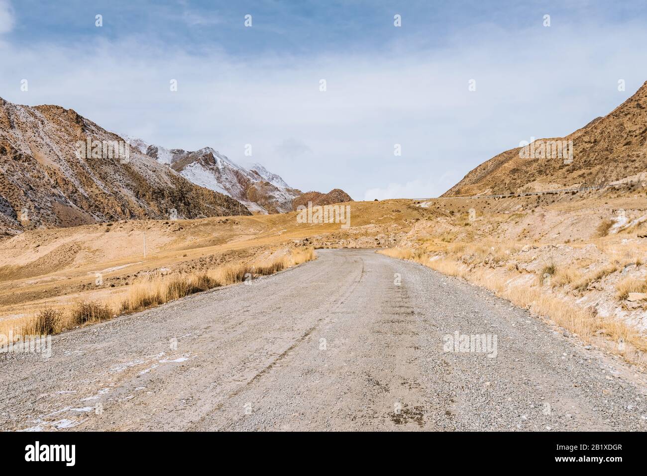 the gravel road on the snow mountain Stock Photo - Alamy