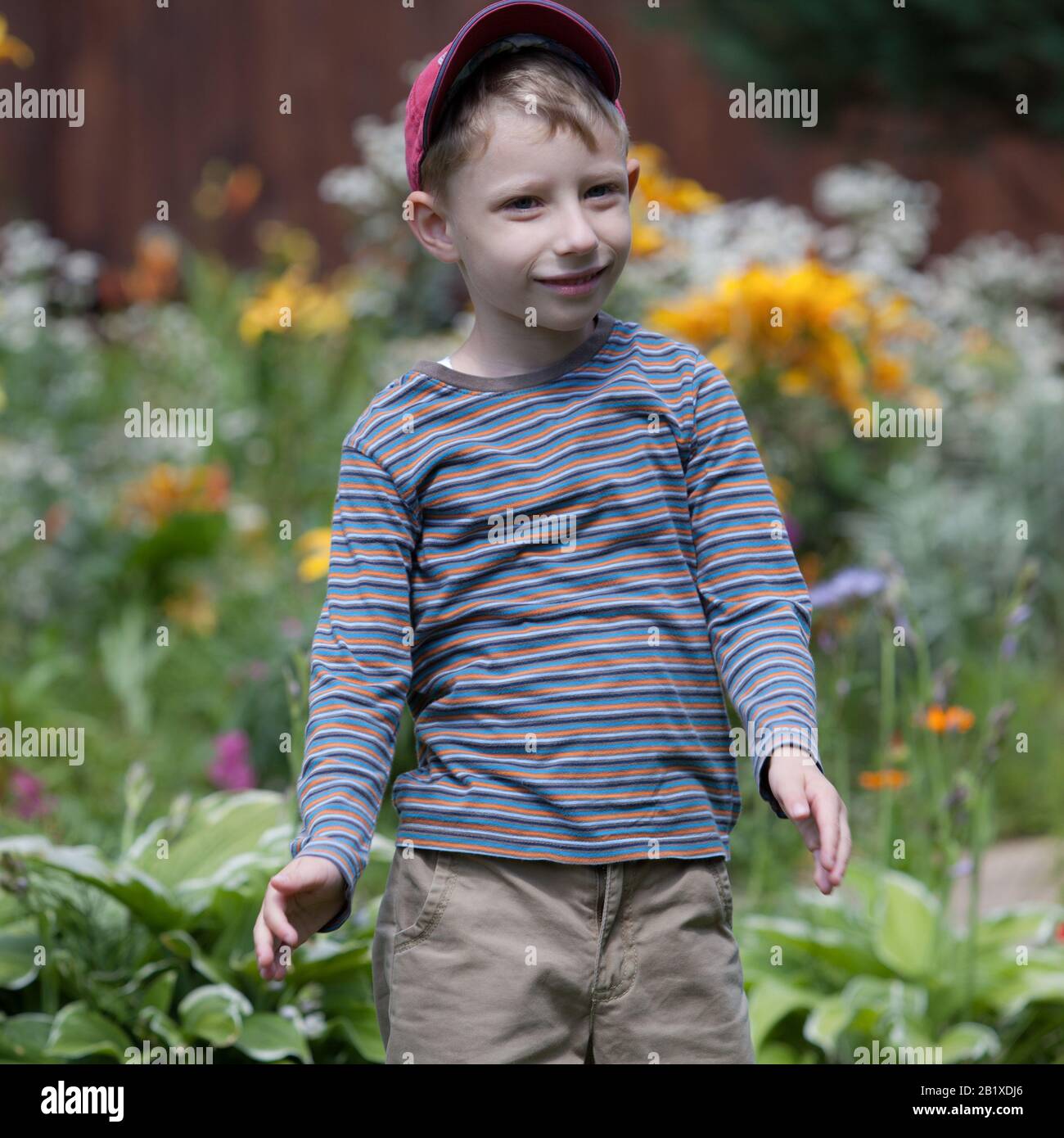 Cute funny fair-haired boy is playing outside Stock Photo - Alamy