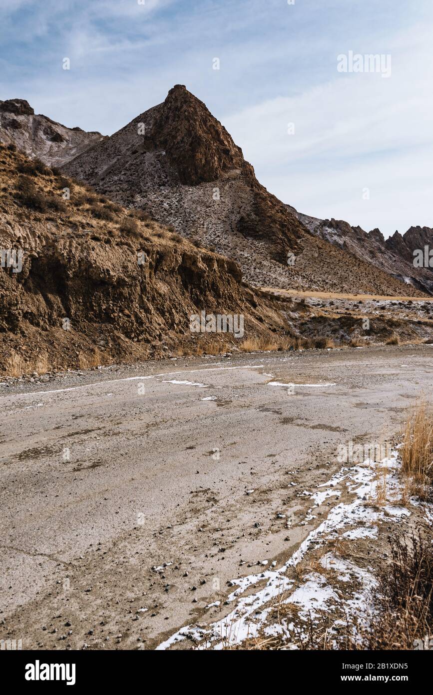 the gravel road on the snow mountain Stock Photo - Alamy