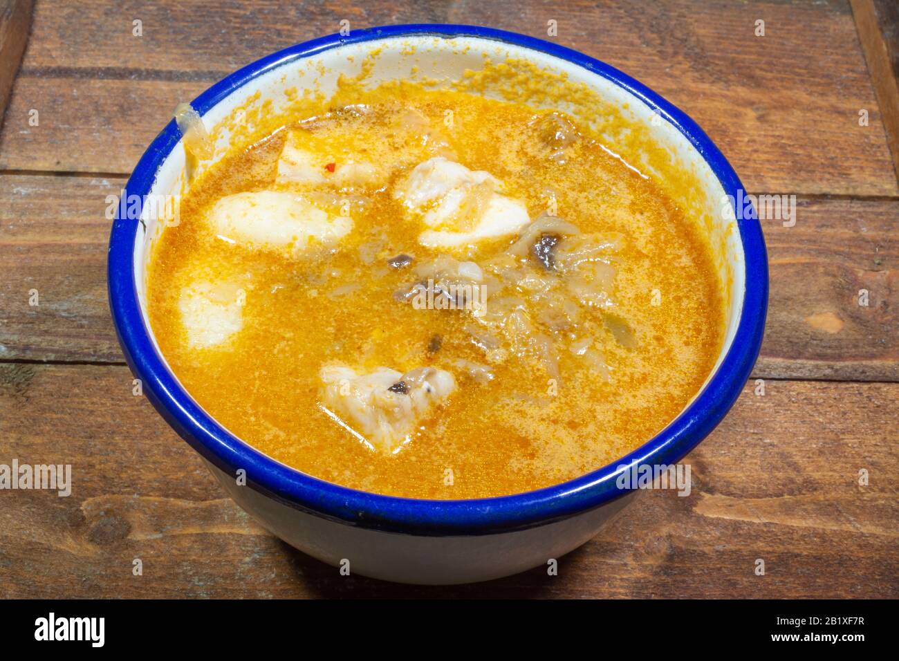 Russian Fish Solyanka in a enamel bowl Stock Photo - Alamy
