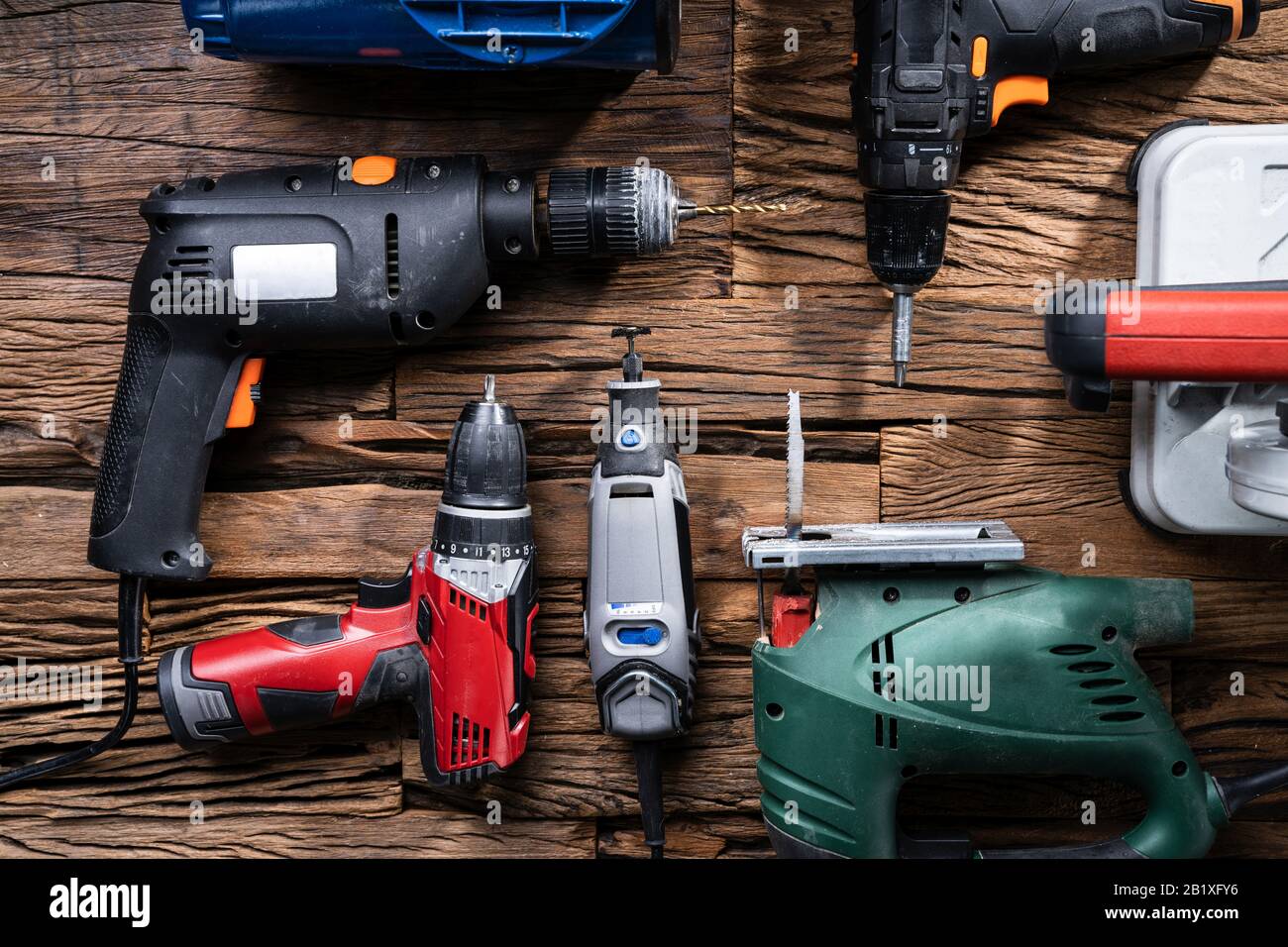 Various Power Tools Laying On Wooden Desk Stock Photo - Alamy