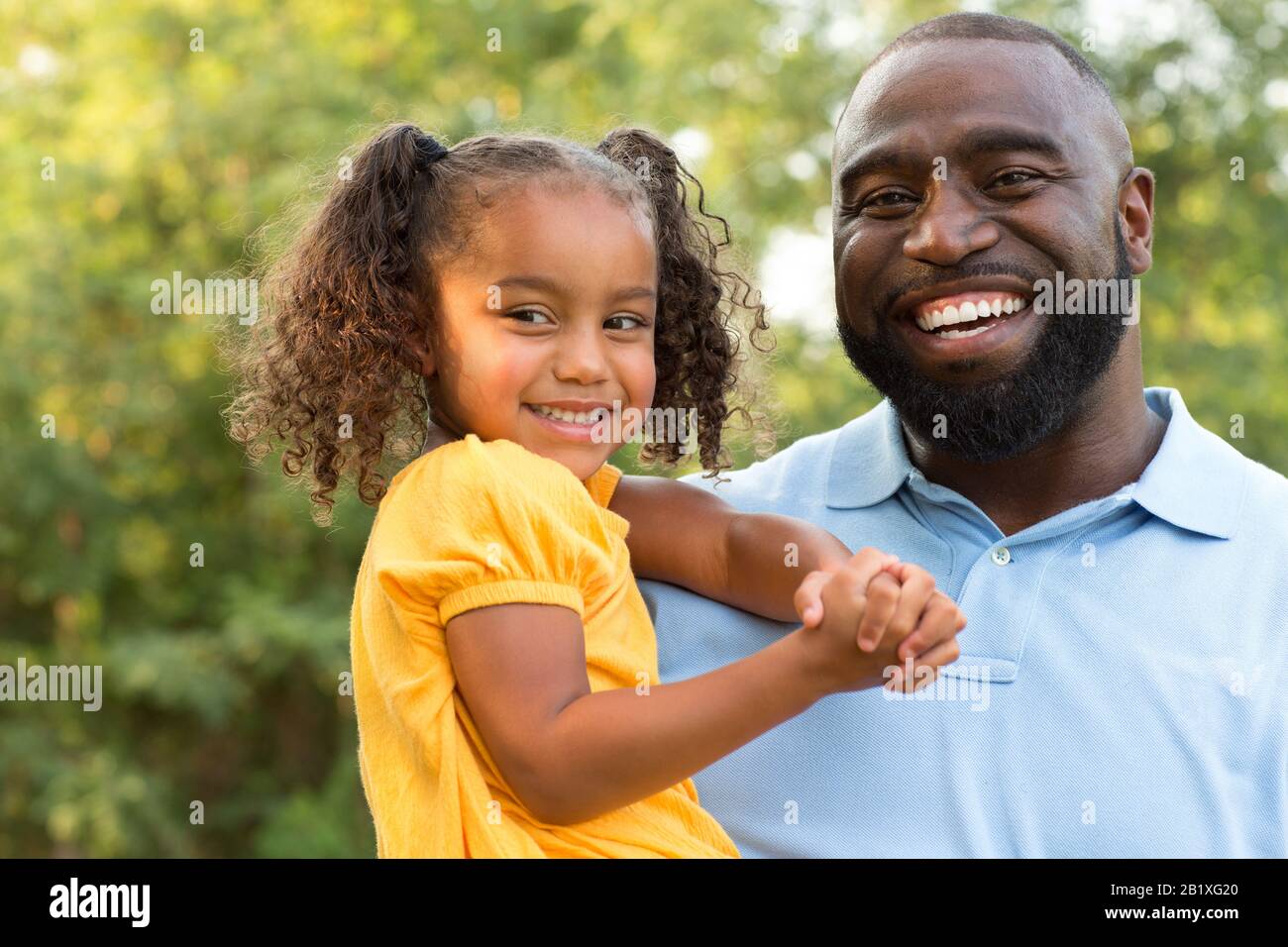 Father laughing and playing with his daugher Stock Photo - Alamy