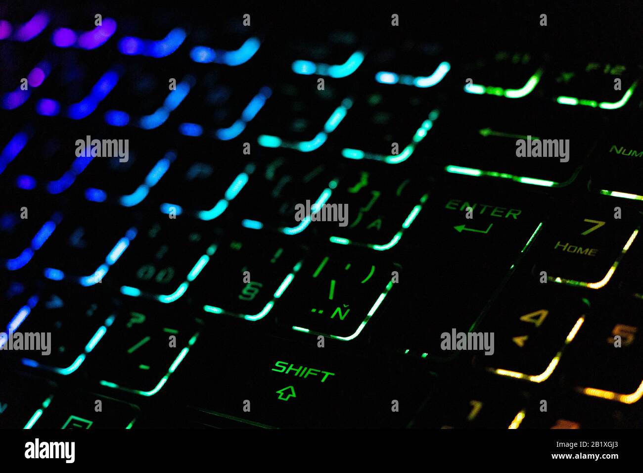 Colorful modern keyboard with rainbow backlight on black background ...